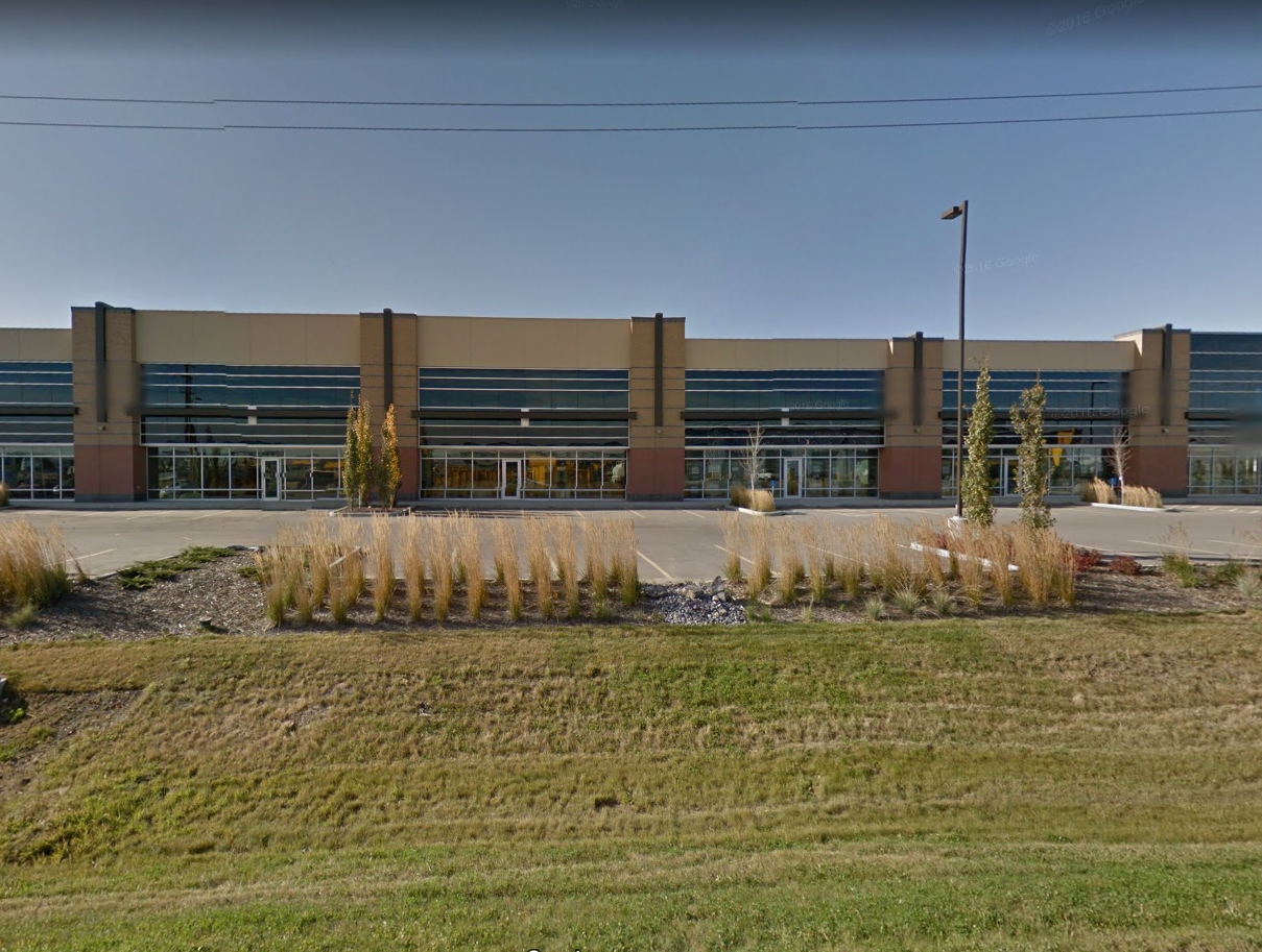 INDUSTRIAL BAY WITH YARD - Royal Park Realty